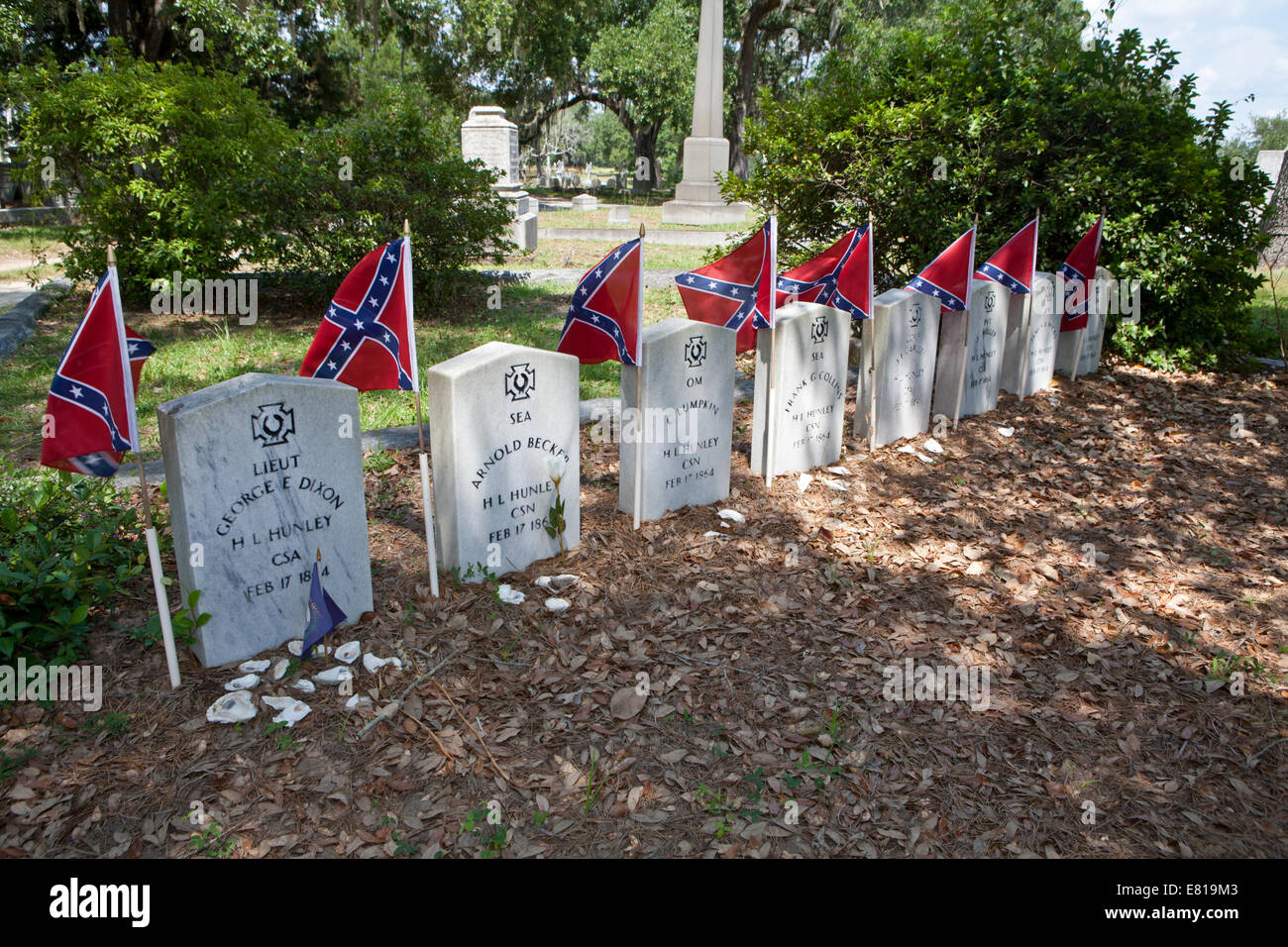 Graves markers of the third naval personnel serving on the H. L. Hunley ...
