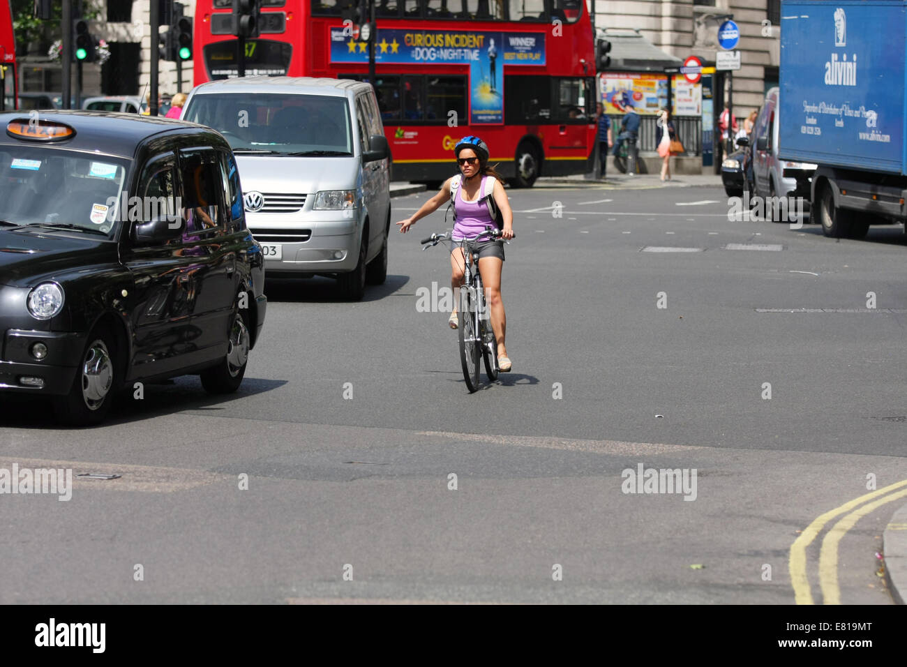 Car turning right cyclist uk hi-res stock photography and images - Alamy