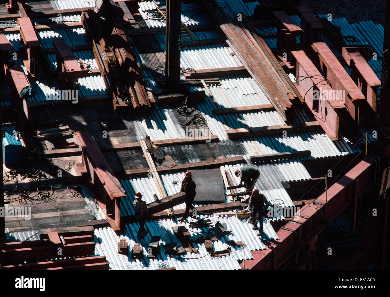Construction of the Philip Morris Building with steel workers in New ...