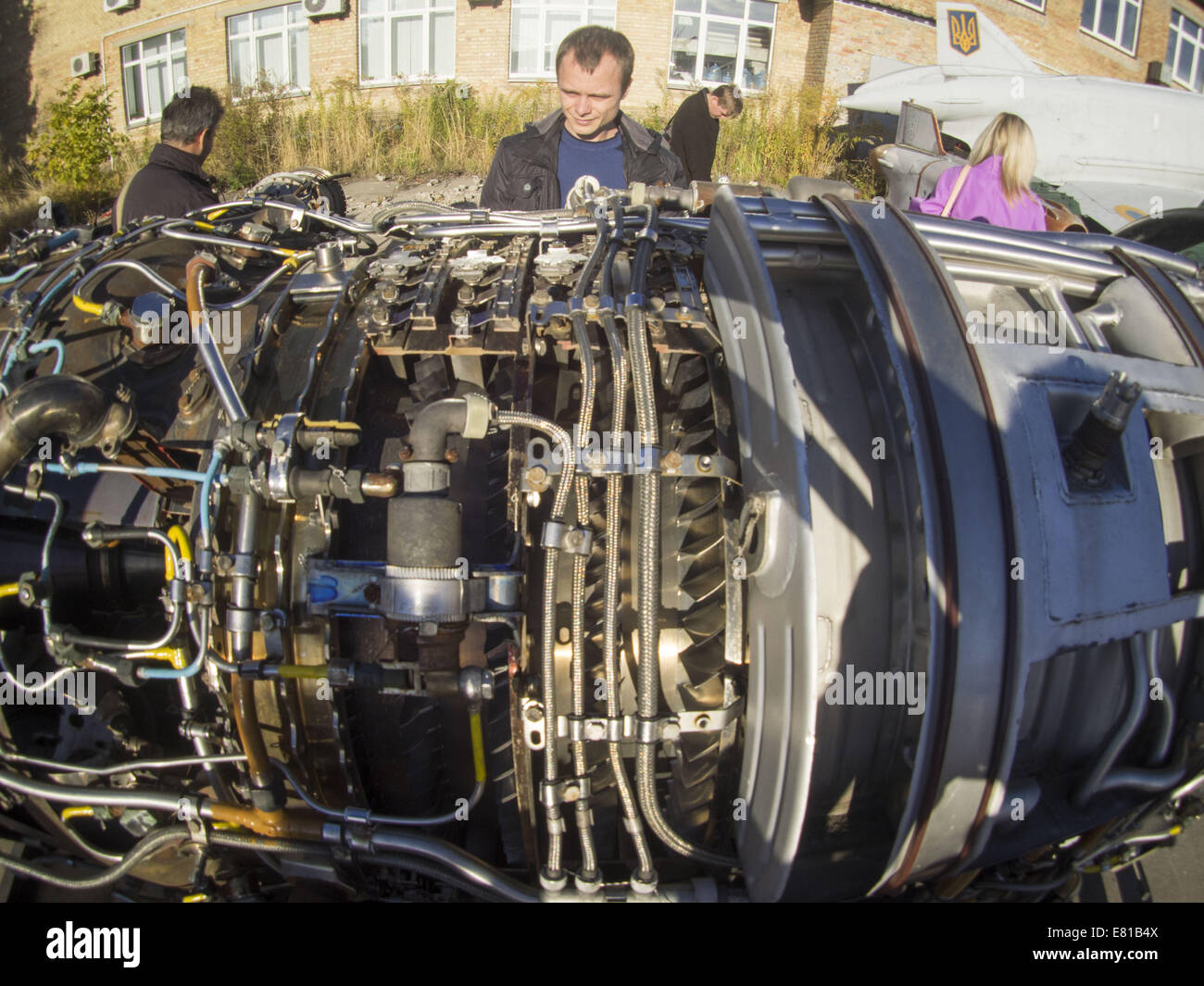 Visitors look at a jet engine fighter. 28th Sep, 2014. -- National ...