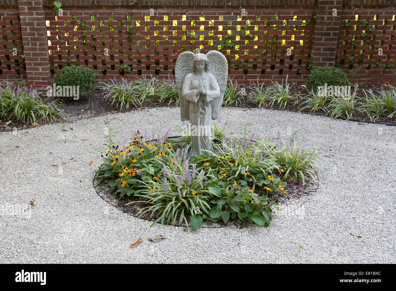 Memorial garden with angel and walkway in cemetery Stock Photo - Alamy