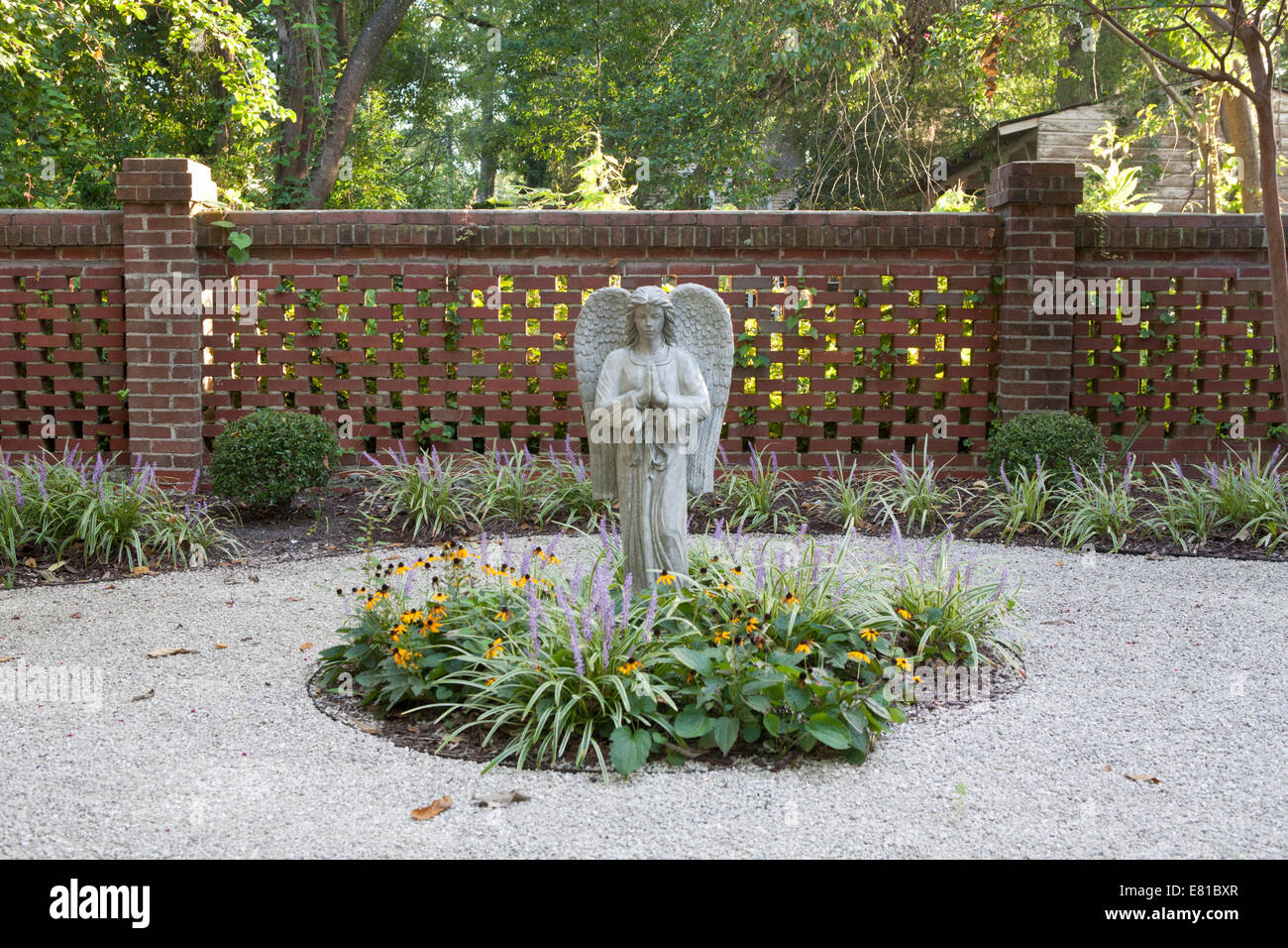 Memorial garden with angel and walkway in cemetery Stock Photo - Alamy