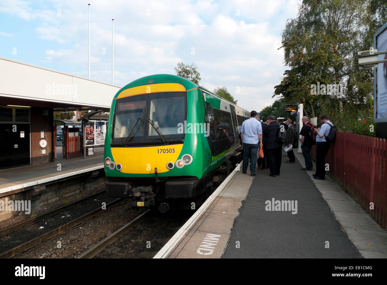 Passengers boarding a train for Shrewsbury at Telford Railway Station ...