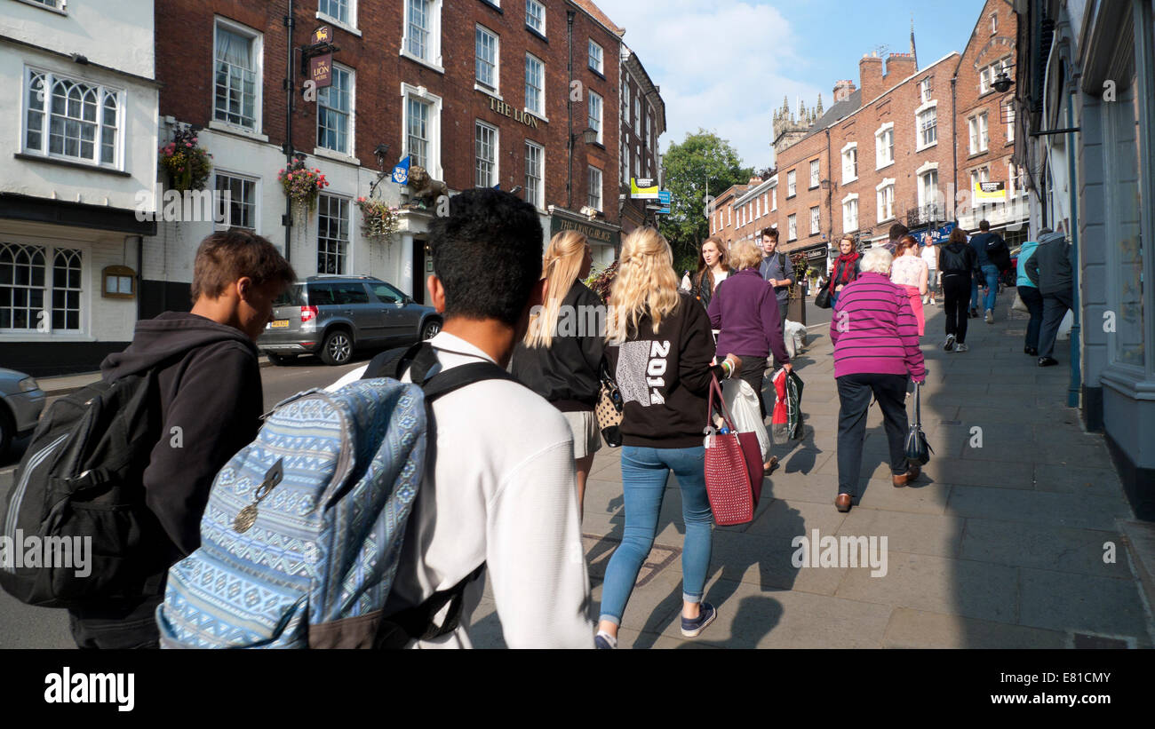 Young British high school students people backpacks rucksacks walking ...