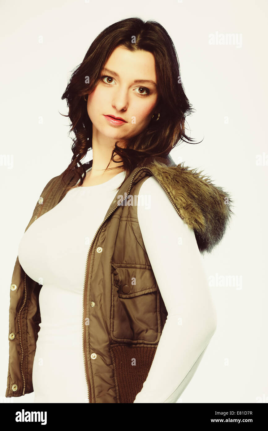 Winter fashion. Young woman plus size model posing in warm waistcoat ...