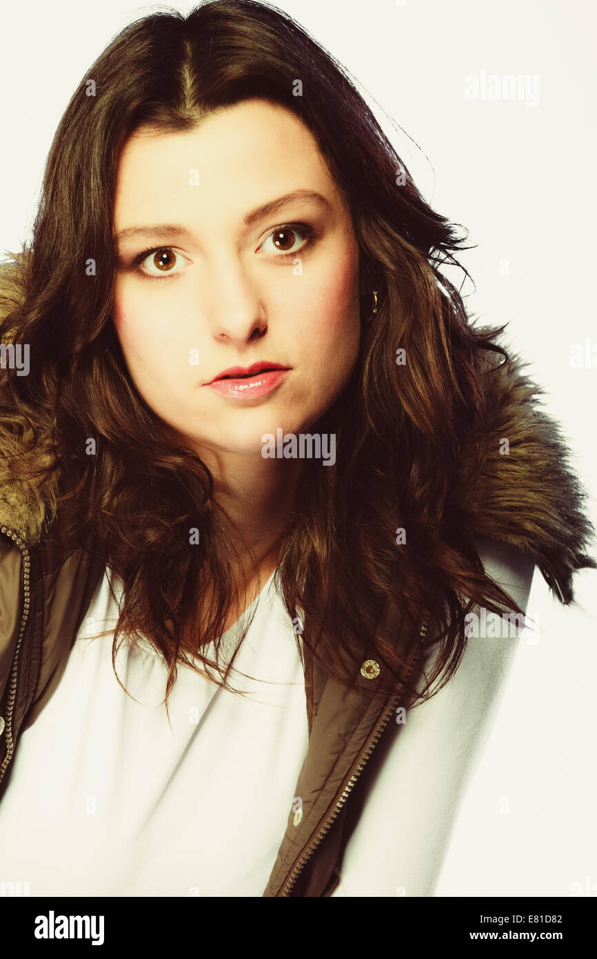 Winter fashion. Young woman plus size model posing in warm waistcoat ...