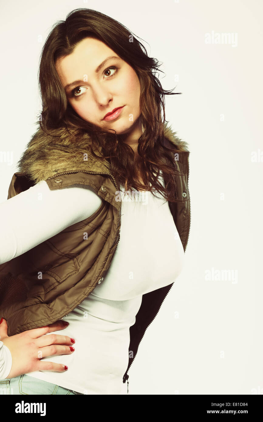 Winter fashion. Young woman plus size model posing in warm waistcoat ...