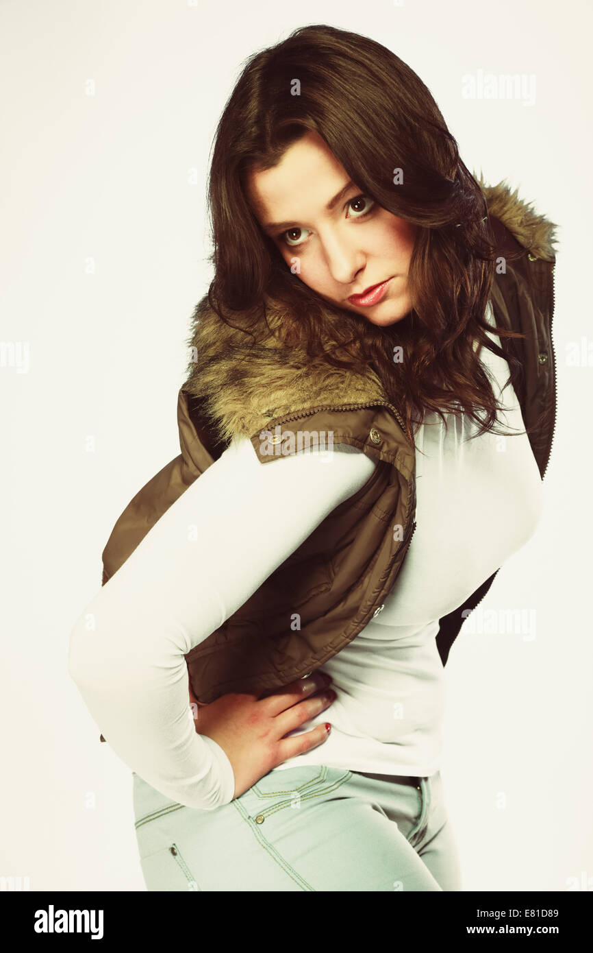 Winter fashion. Young woman plus size model posing in warm waistcoat ...