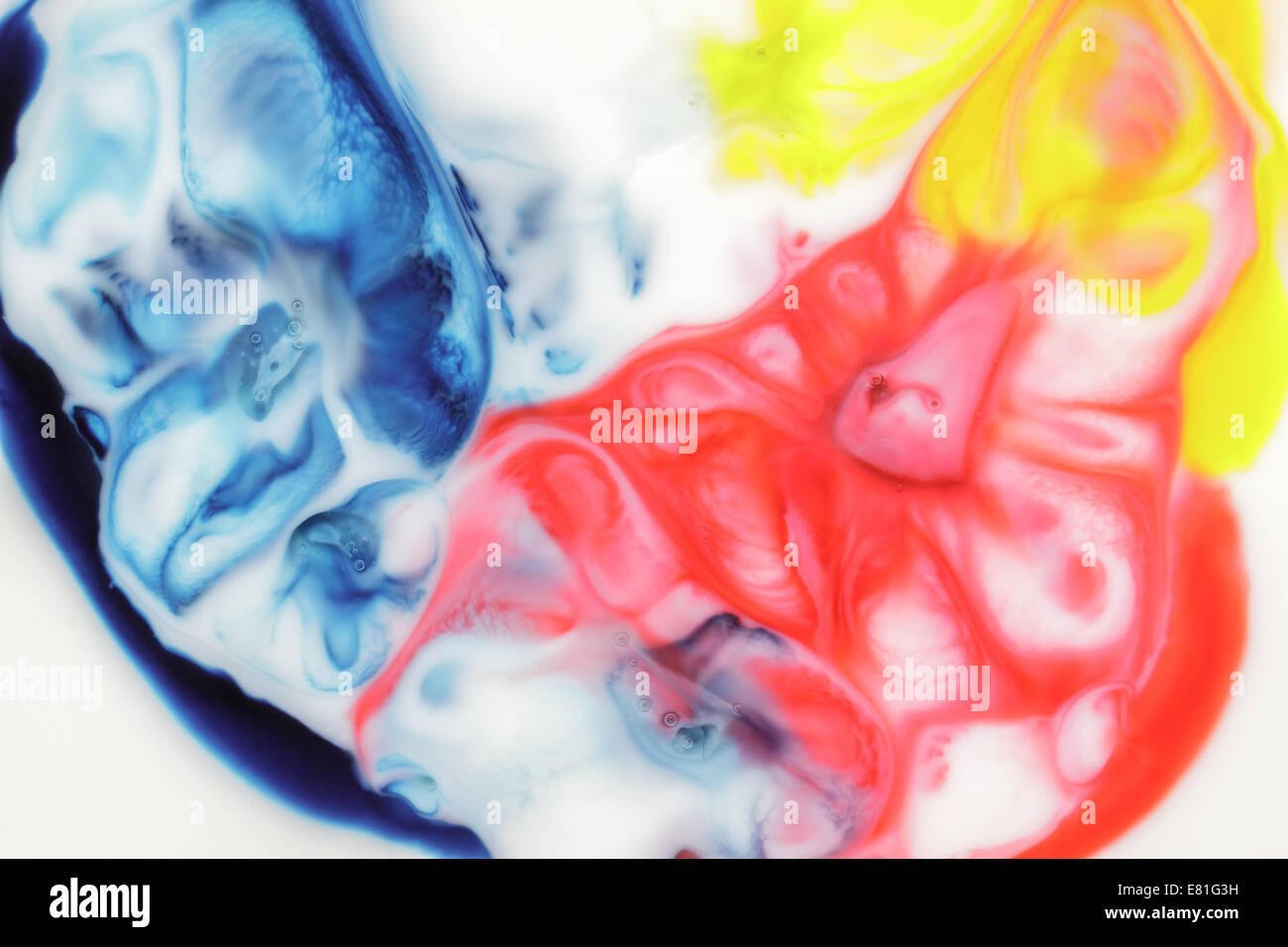 food coloring on milk abstract background Stock Photo - Alamy