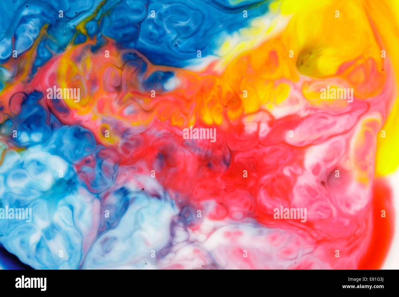 food coloring on milk abstract background Stock Photo - Alamy