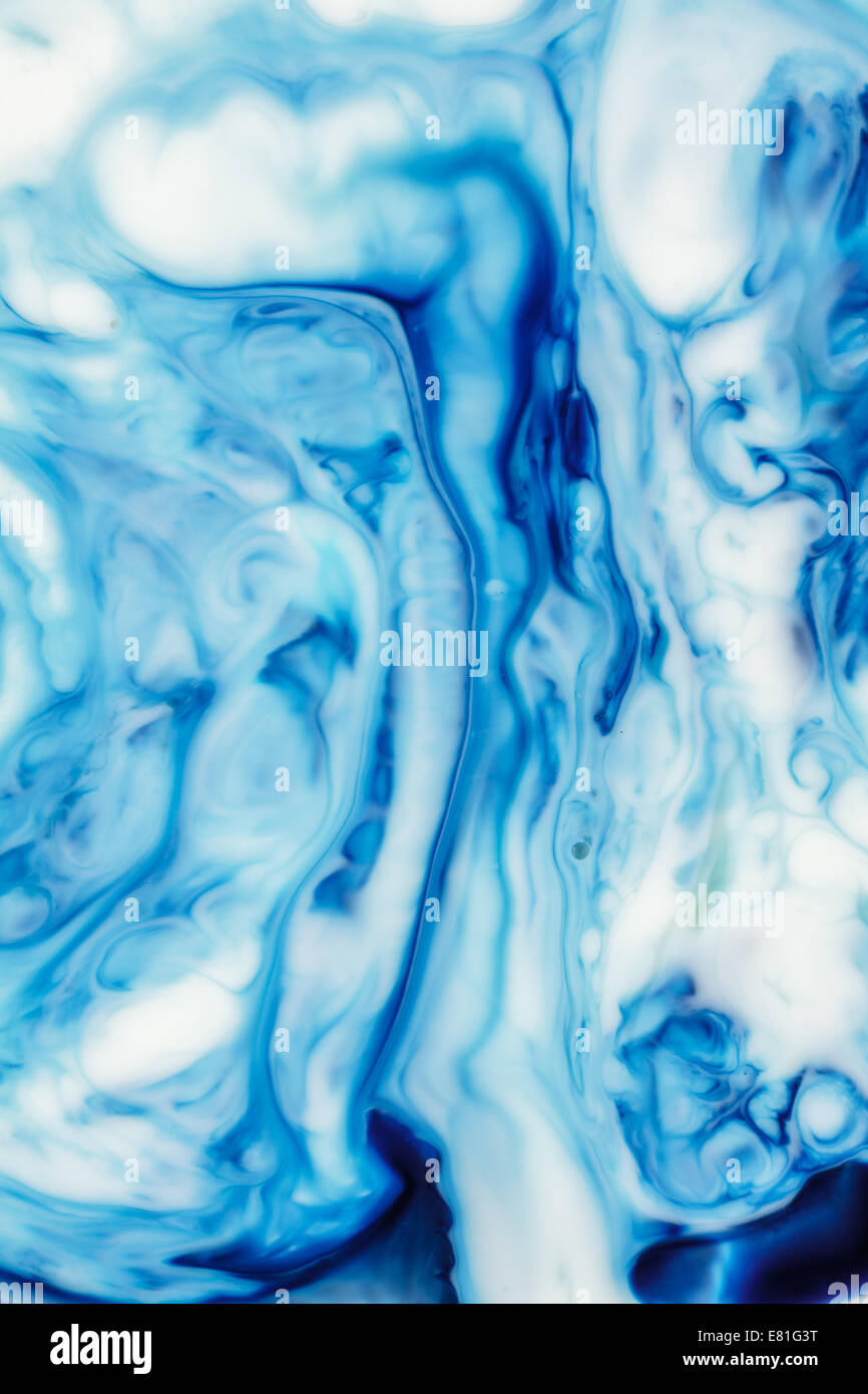 food coloring on milk abstract background Stock Photo - Alamy