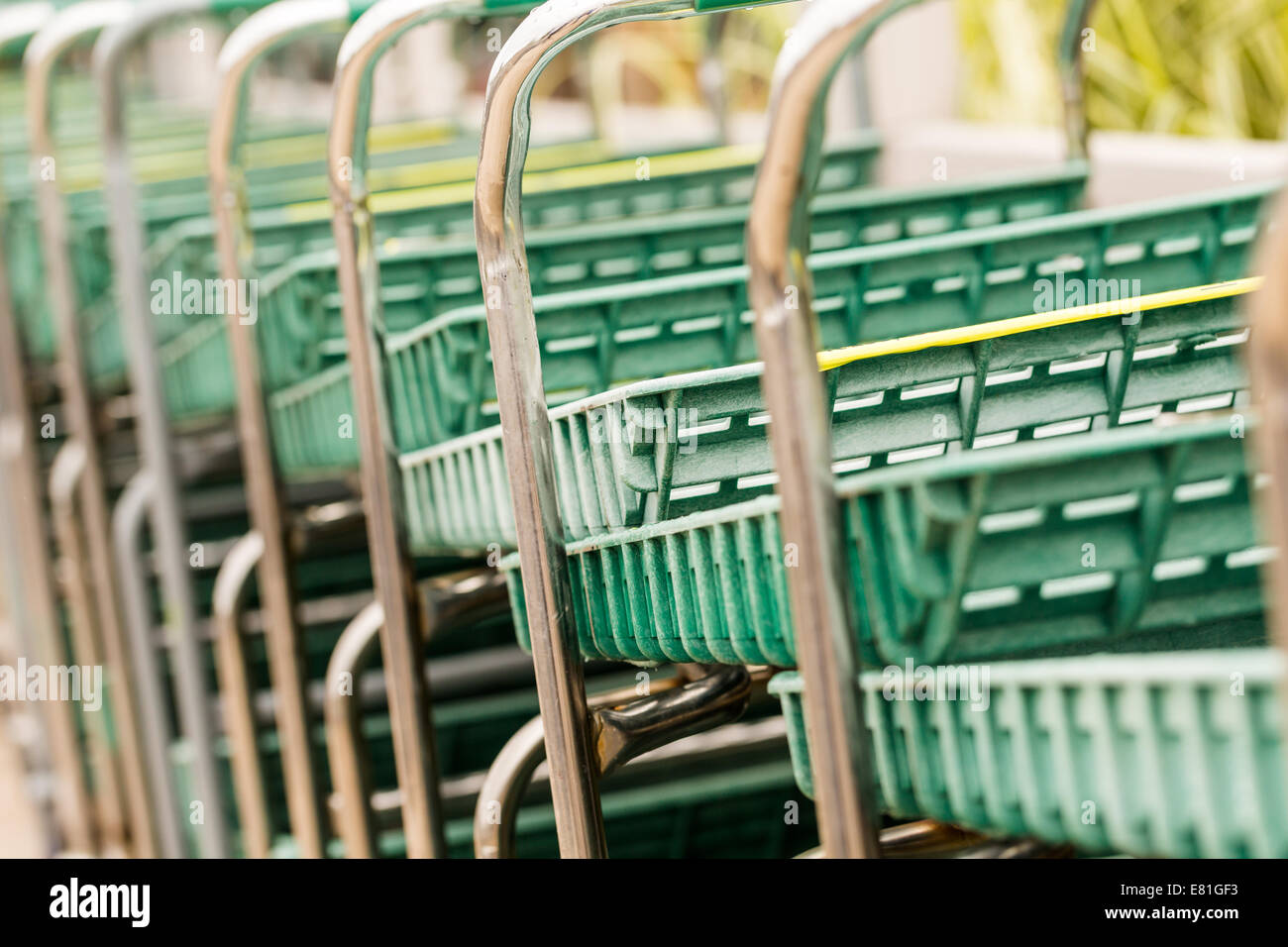 Large green shopping cart in a row Stock Photo - Alamy