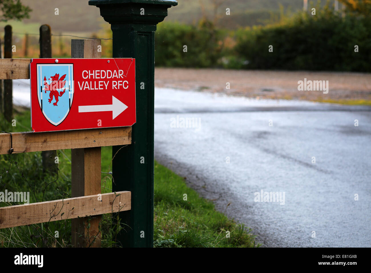 Direction sign with arrow into the Cheddar Valley Rugby RFC Club car ...
