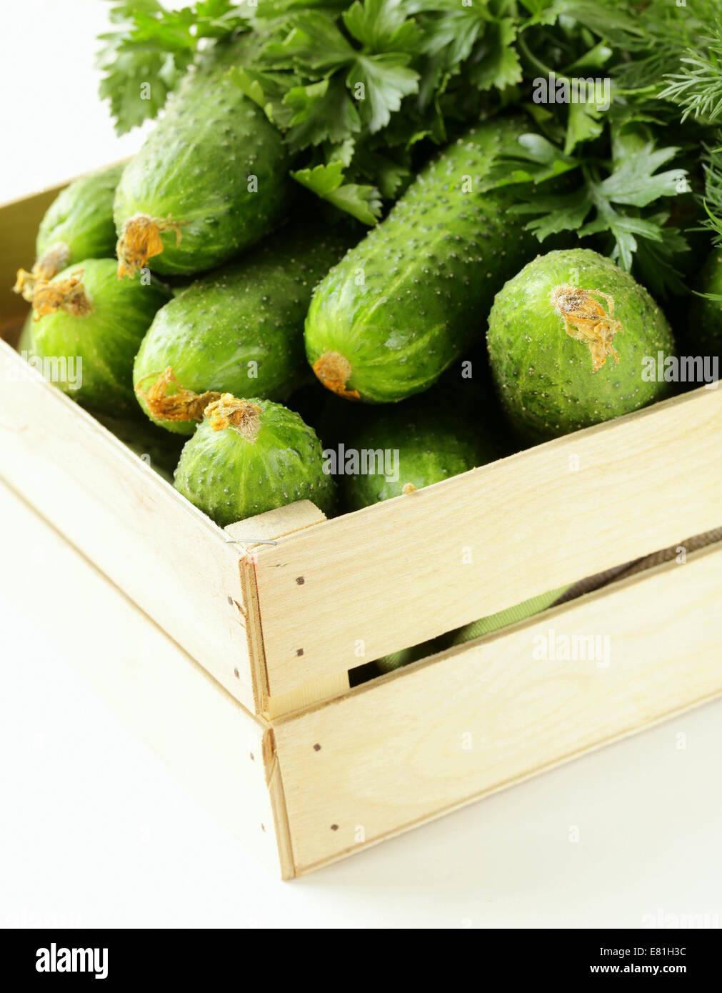 fresh organic cucumbers in a wooden box Stock Photo - Alamy