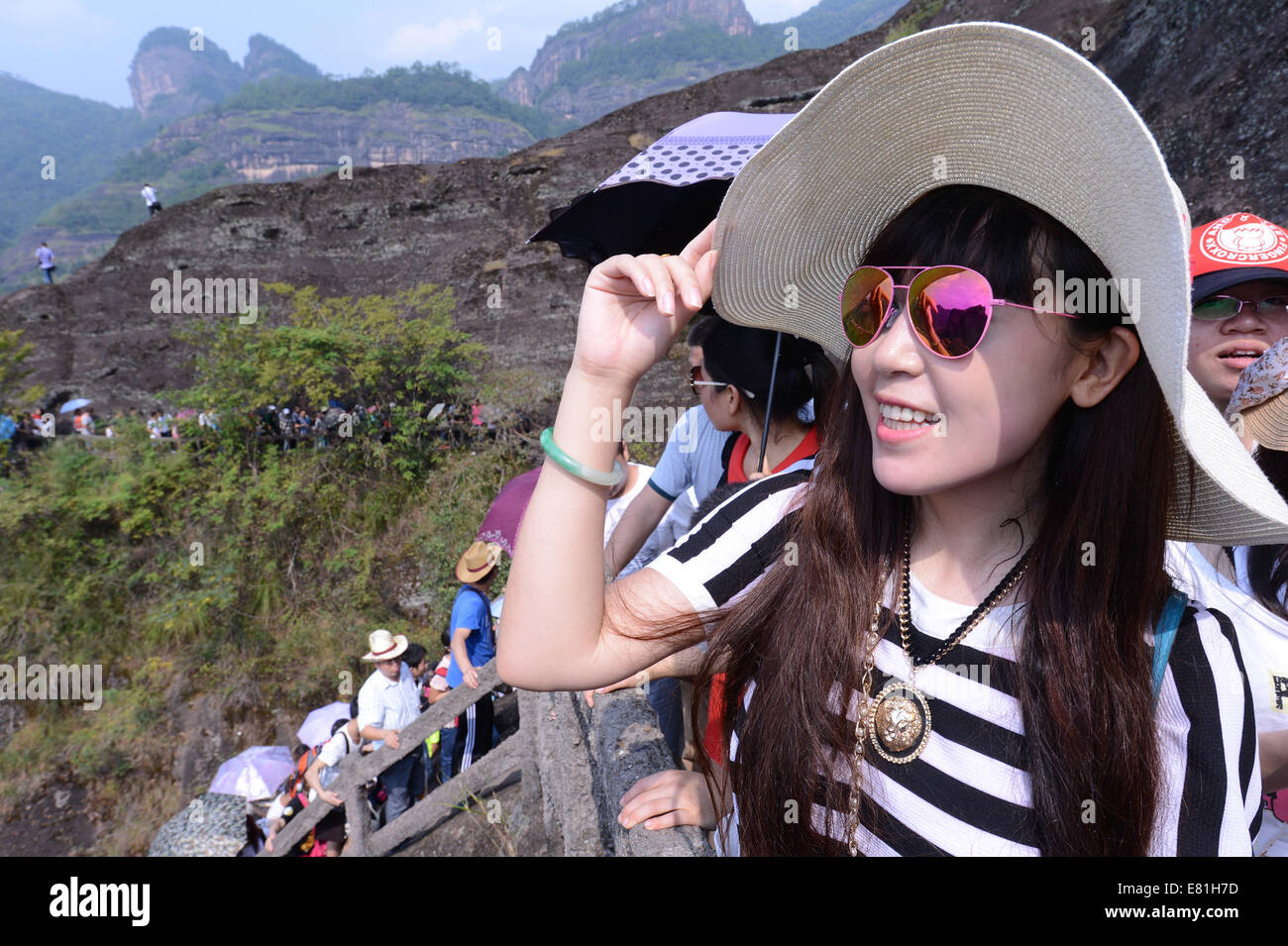 Wuyishan. 27th Sep, 2014. Tourists visit Tianyou Peak of Wuyi Mountain ...