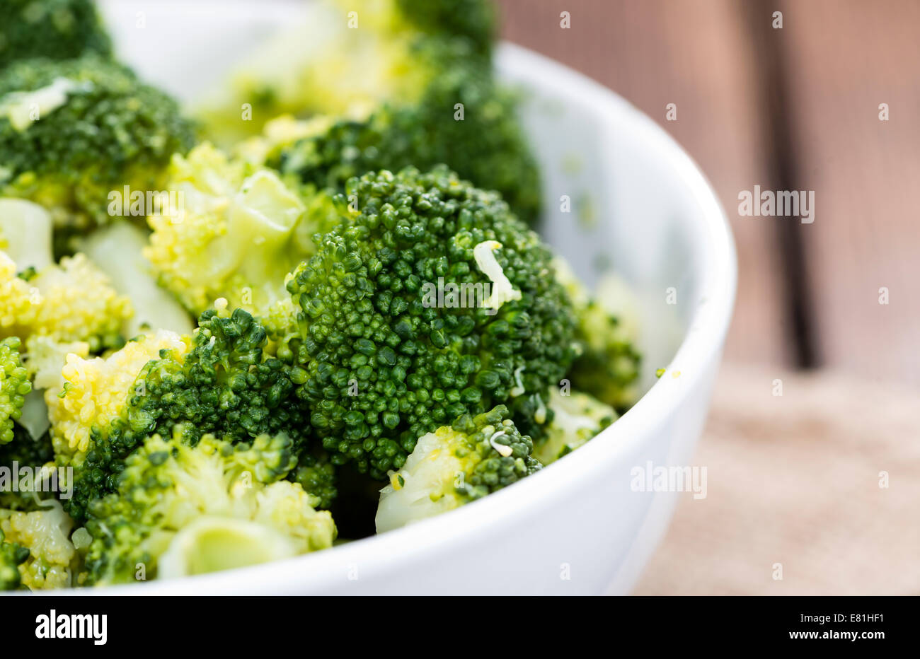 Portion of fresh Cooked Broccoli (detailed close-up shot) on wooden ...