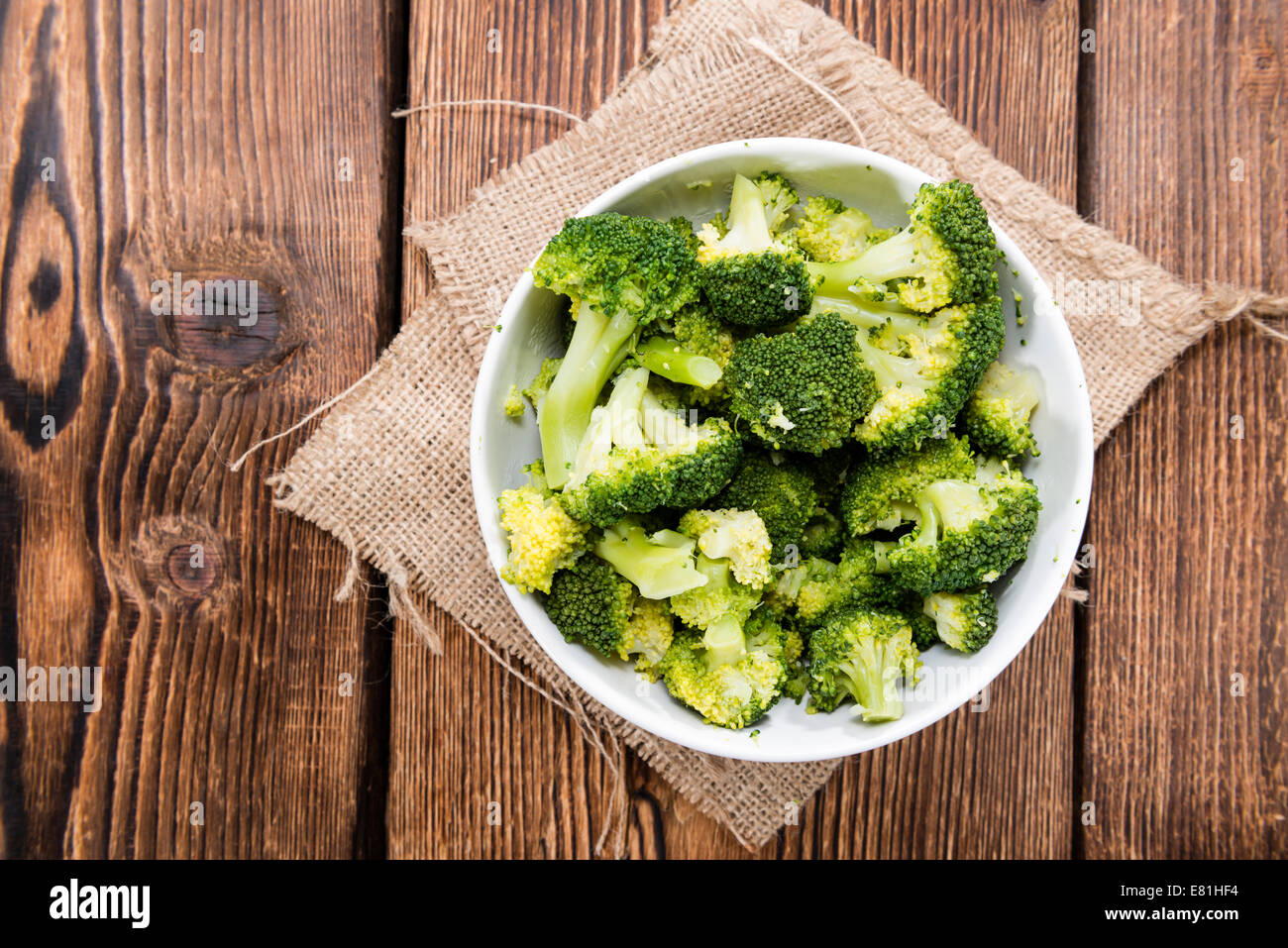 Portion of fresh Cooked Broccoli (detailed close-up shot) on wooden ...