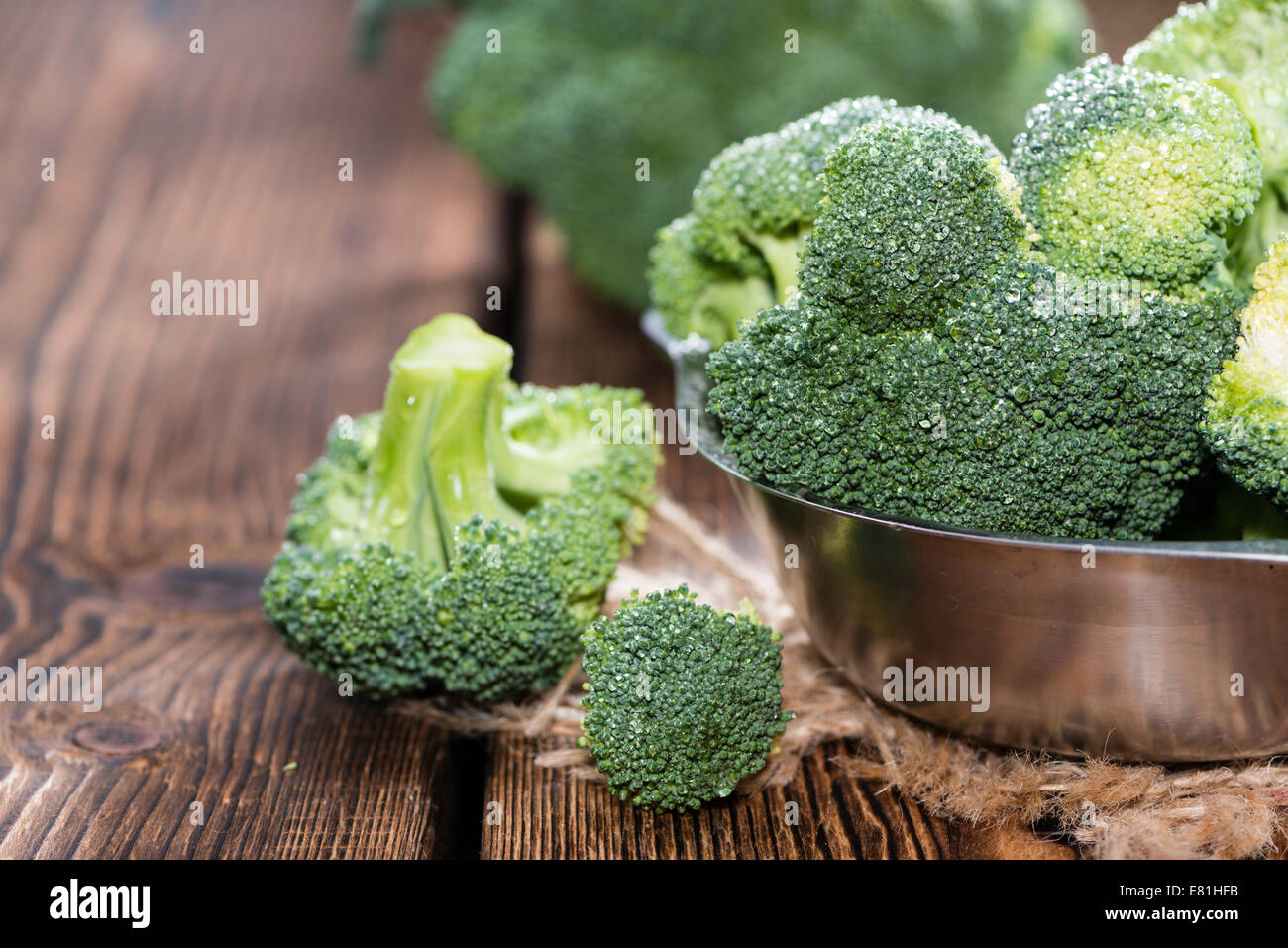 Raw Broccoli (detailed close-up shot) on wooden background Stock Photo ...