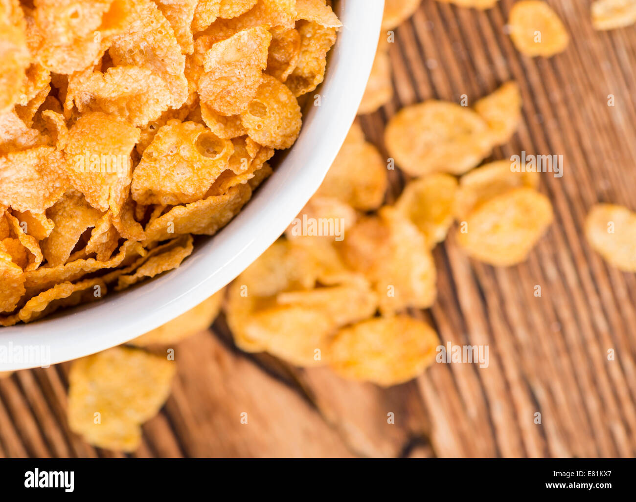 Old wooden table with a portion of Cornflakes Stock Photo - Alamy