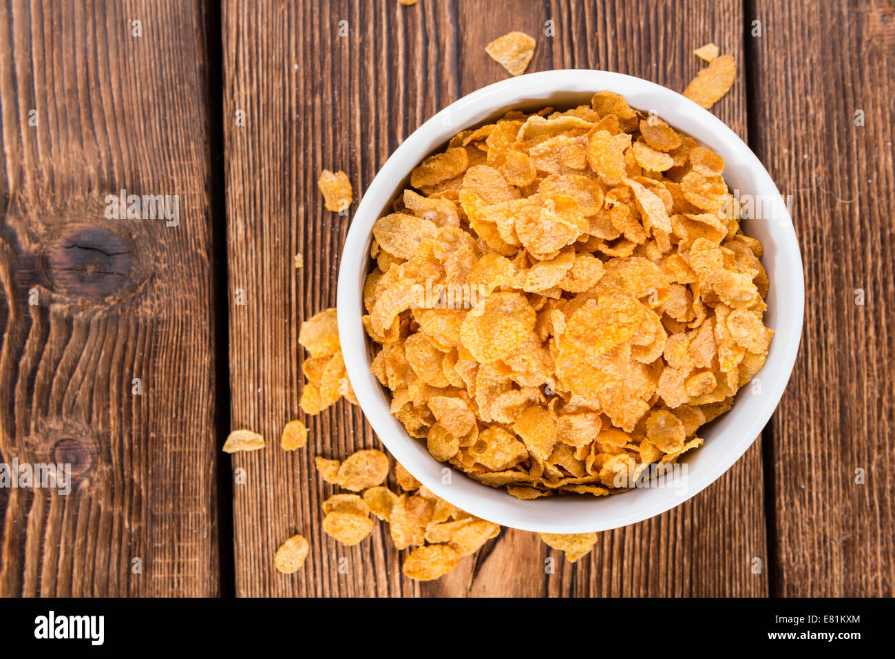 Portion of golden Cornflakes on wooden background (close-up shot Stock ...