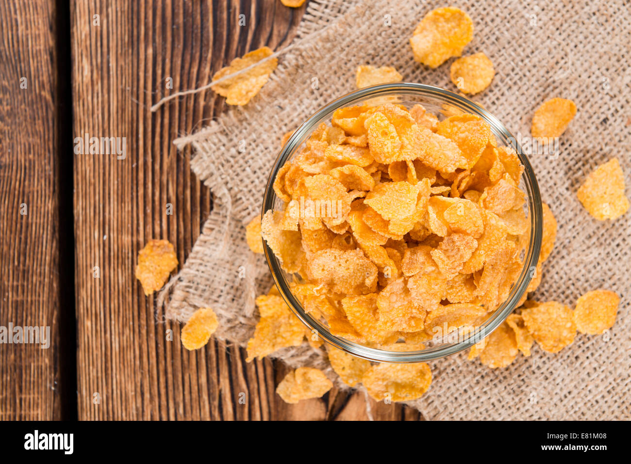 Portion of golden Cornflakes on wooden background (close-up shot Stock ...
