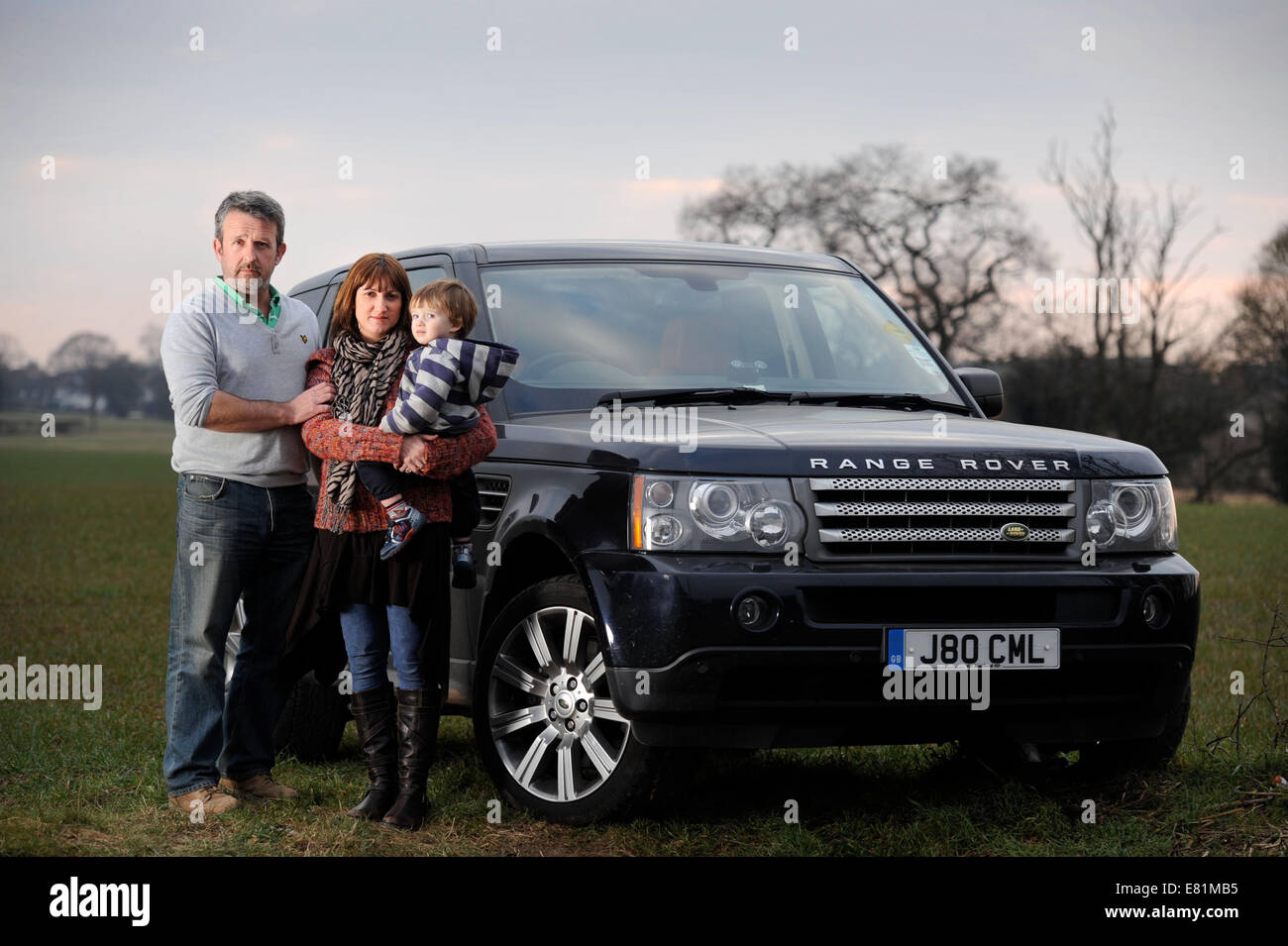 Family with a four wheel drive car UK Stock Photo - Alamy