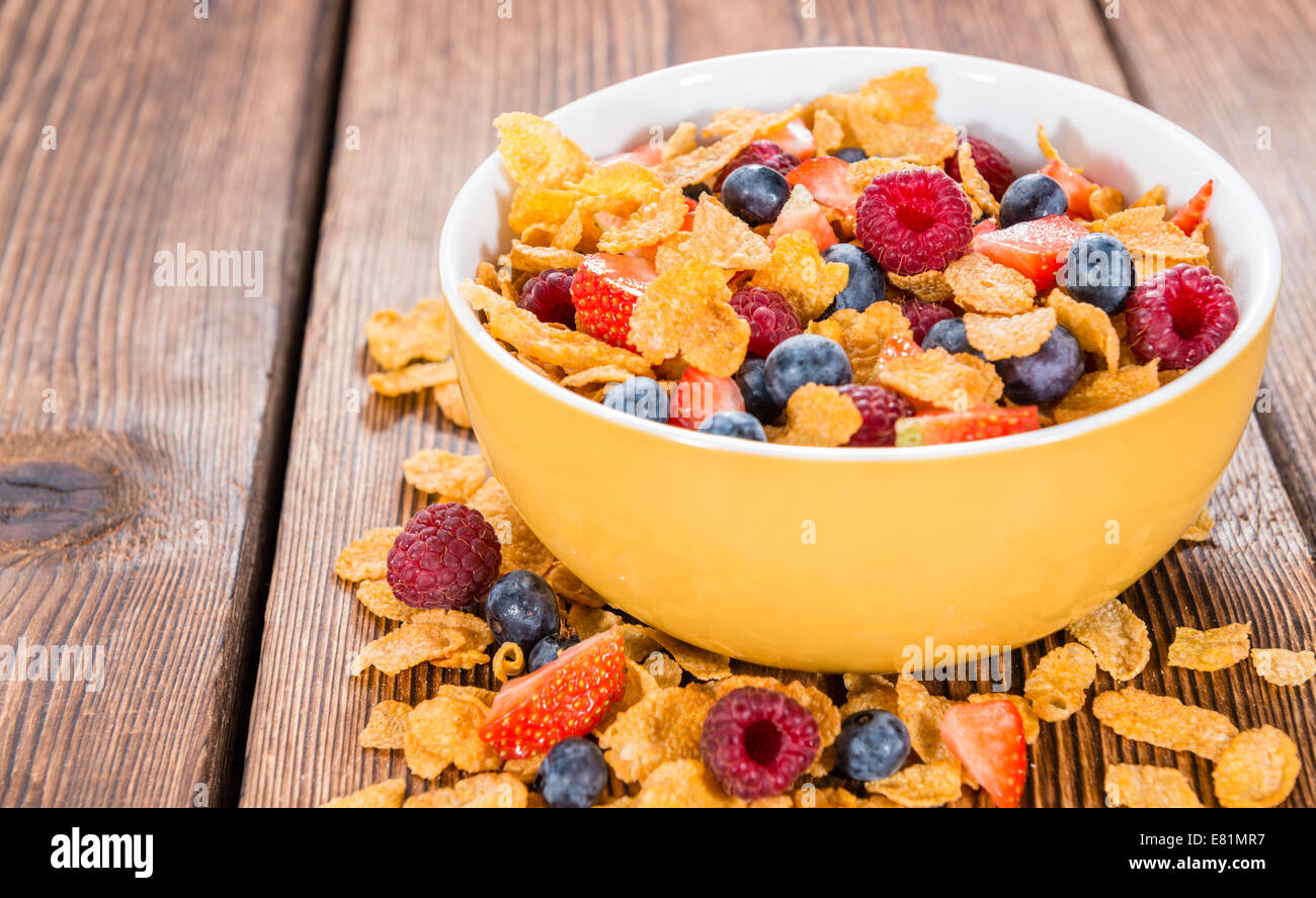 Fresh made Breakfast (Cornflakes with different Berries) on wooden ...