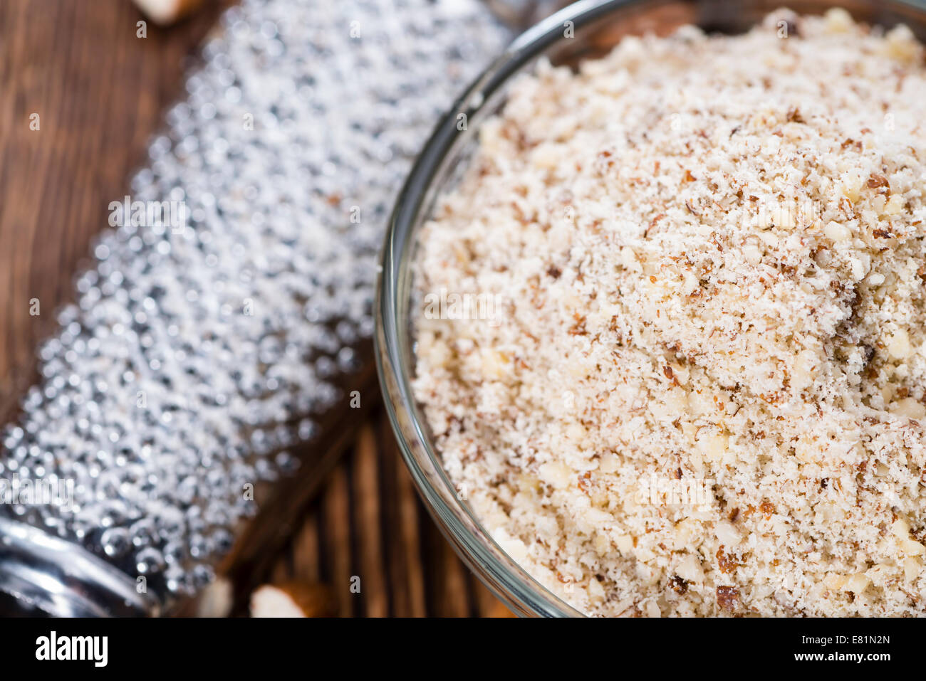 Portion of fresh grated Almonds on wooden background Stock Photo - Alamy