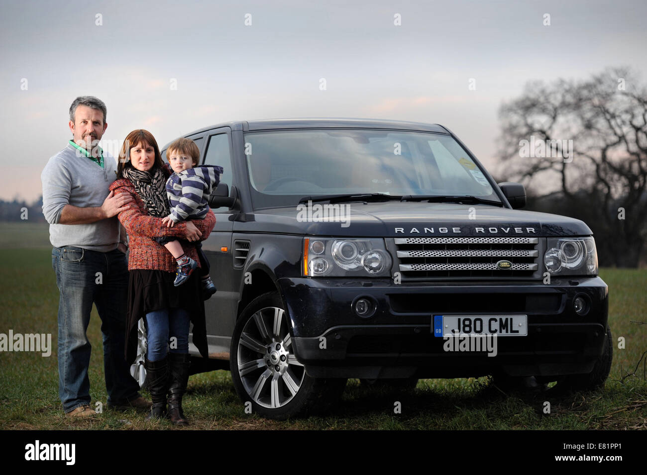 Family with a four wheel drive car UK Stock Photo - Alamy