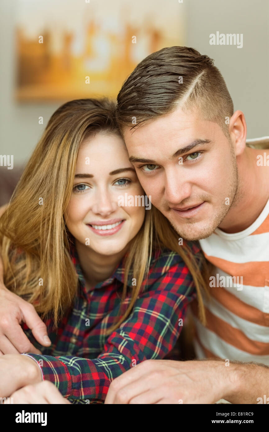 Cute couple smiling at camera Stock Photo - Alamy