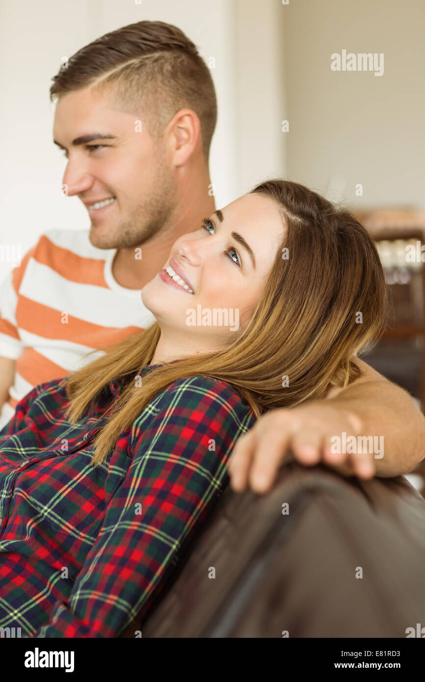 Cute couple relaxing on couch Stock Photo - Alamy