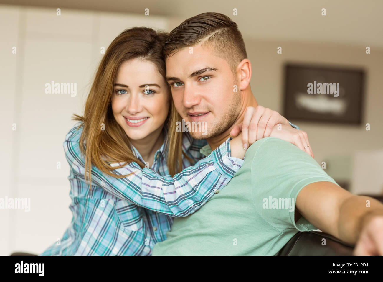 Cute couple relaxing on couch Stock Photo - Alamy