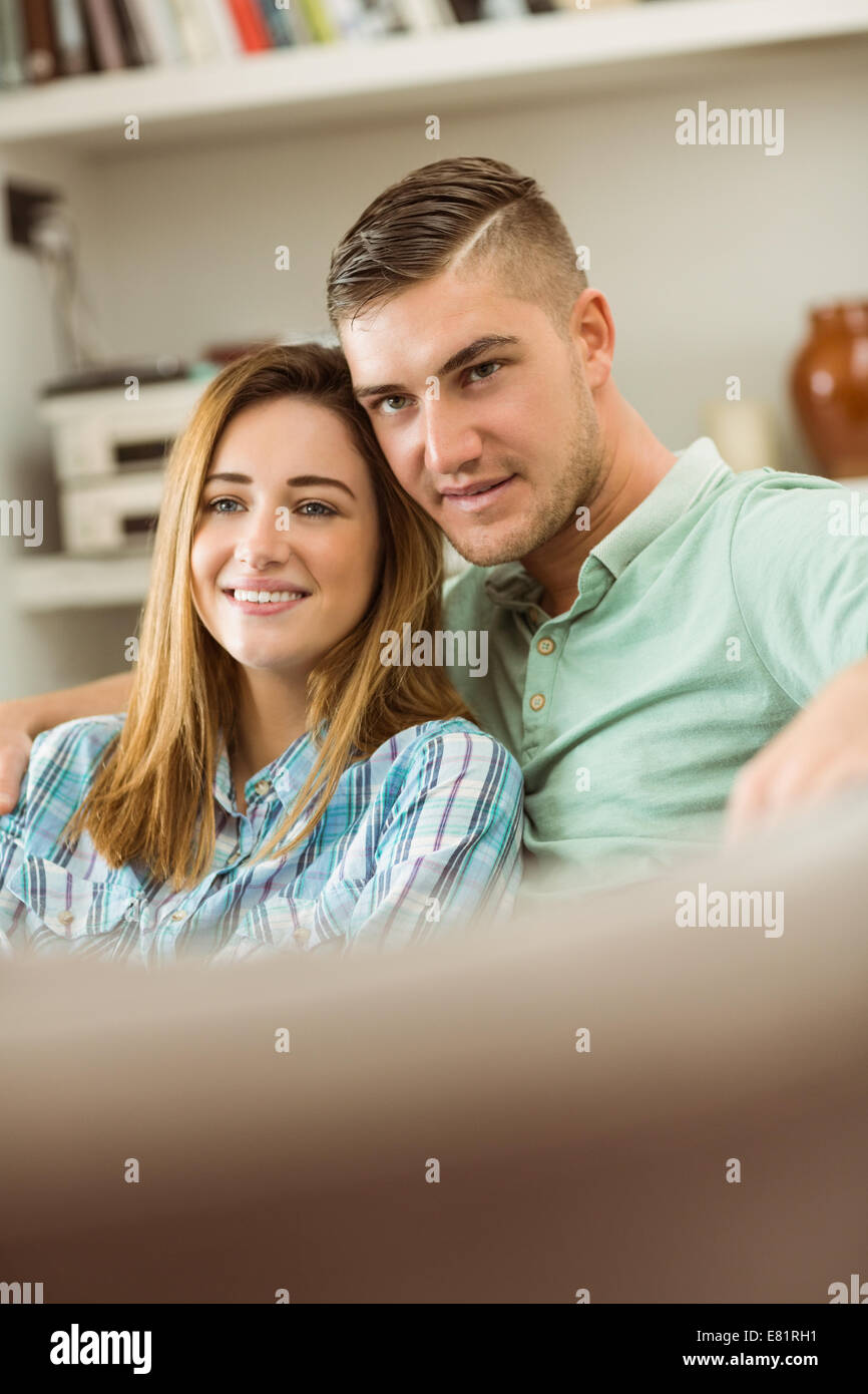 Cute couple relaxing on couch Stock Photo - Alamy