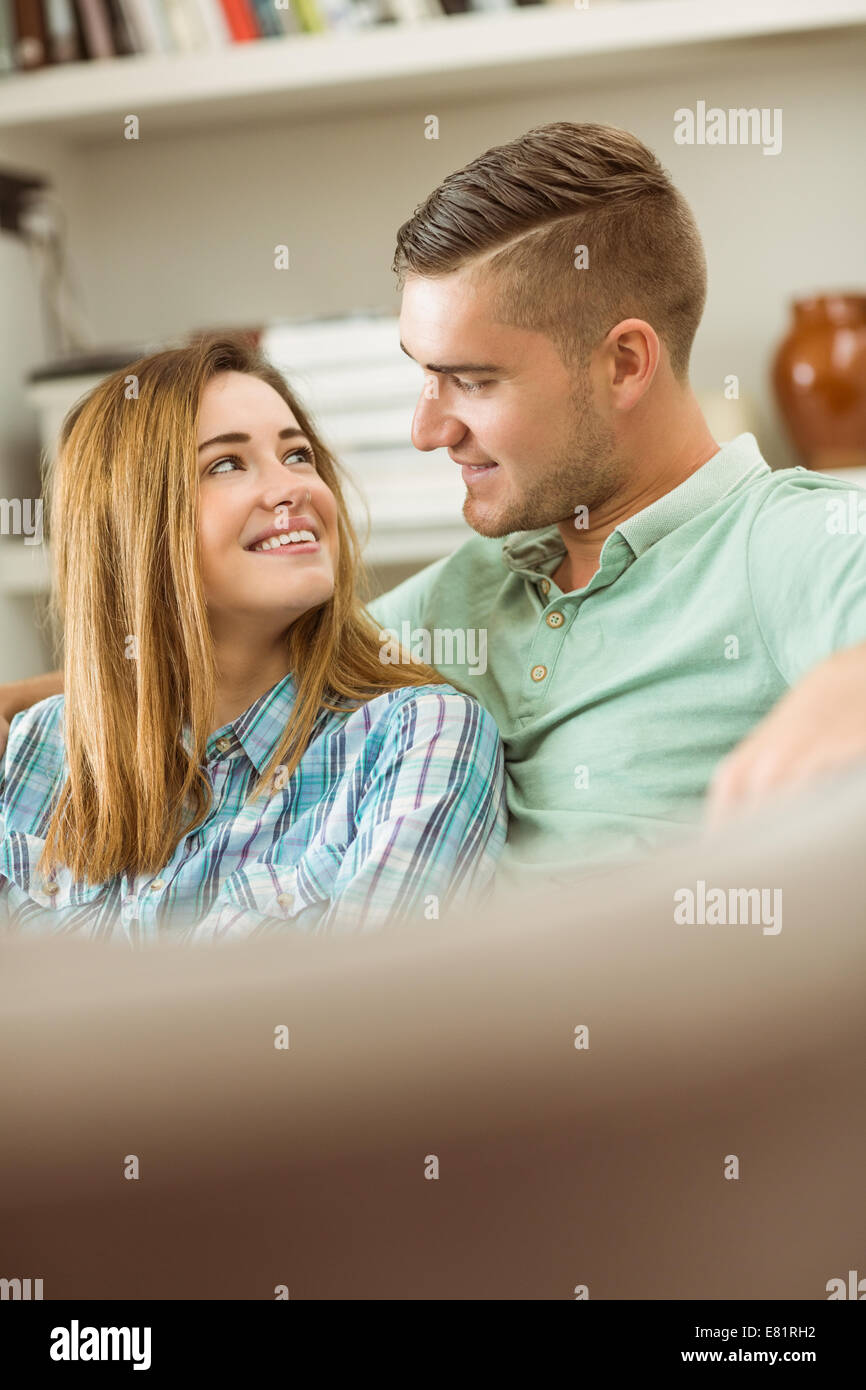 Cute couple relaxing on couch Stock Photo - Alamy