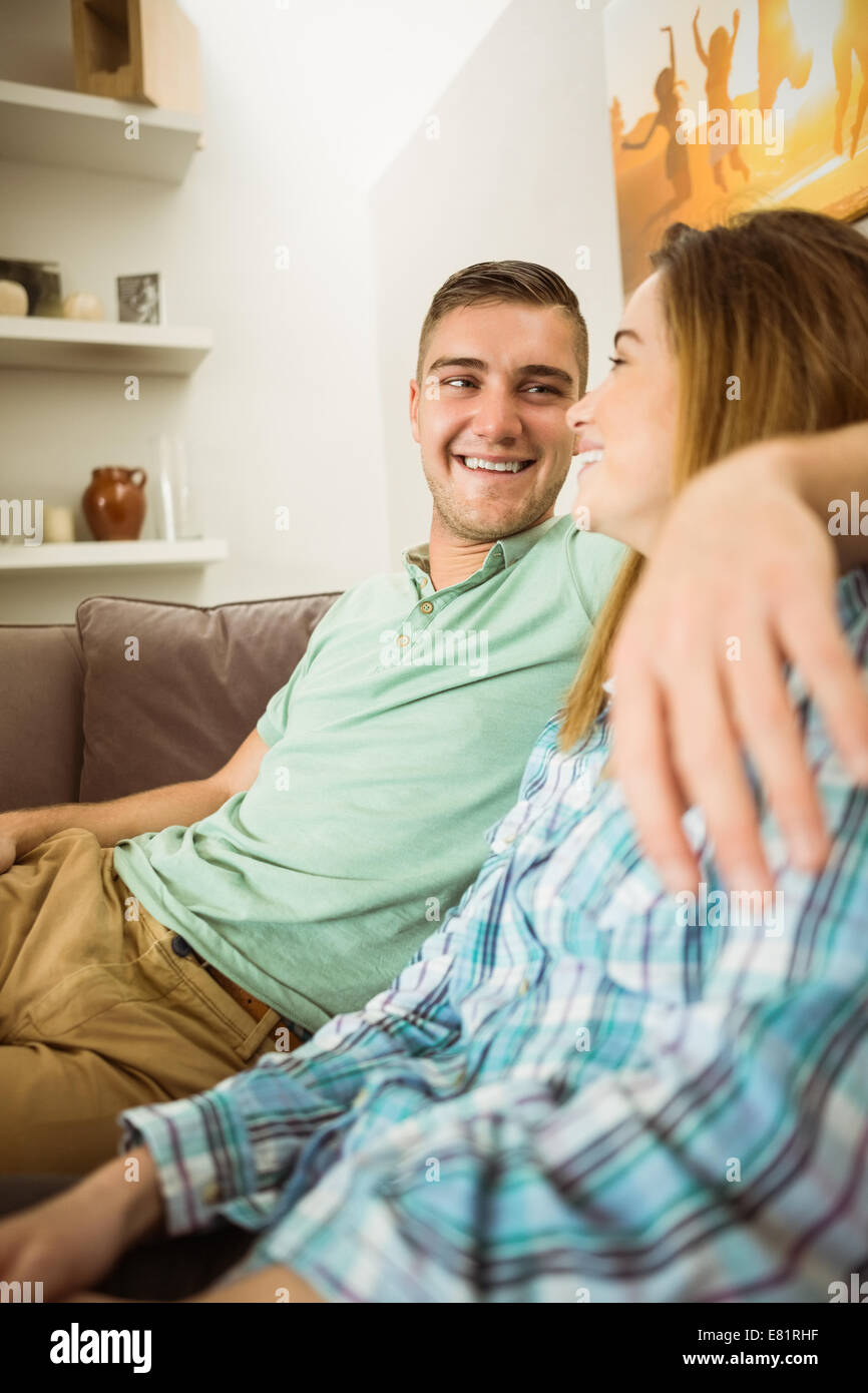 Cute couple relaxing on couch Stock Photo - Alamy