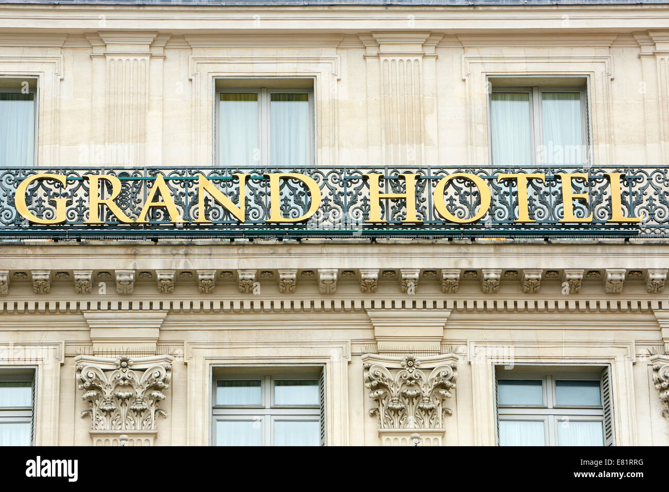 Hotel Sign On The Side Of The Building Le Grand Hotel
