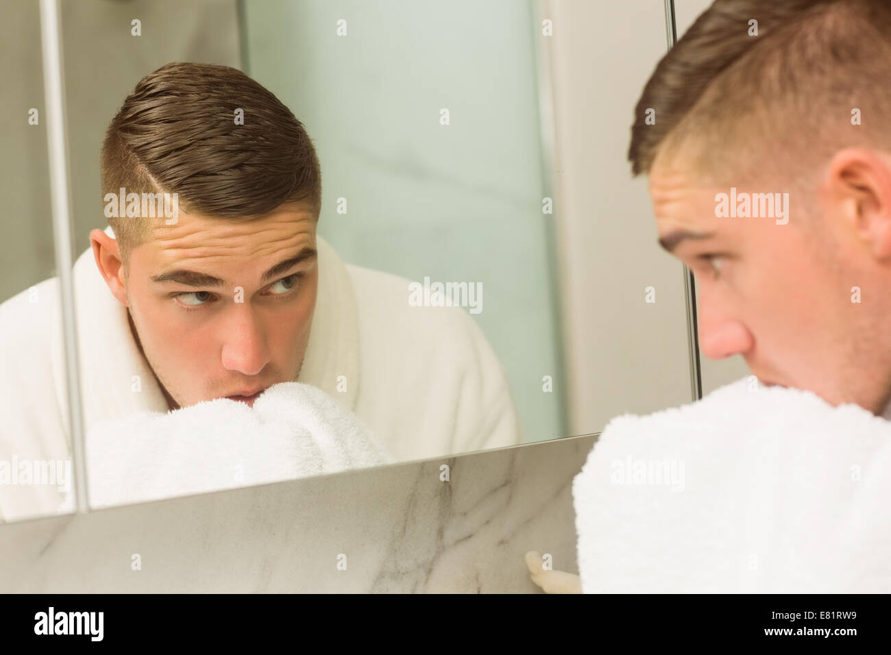 Handsome man washing his face Stock Photo - Alamy