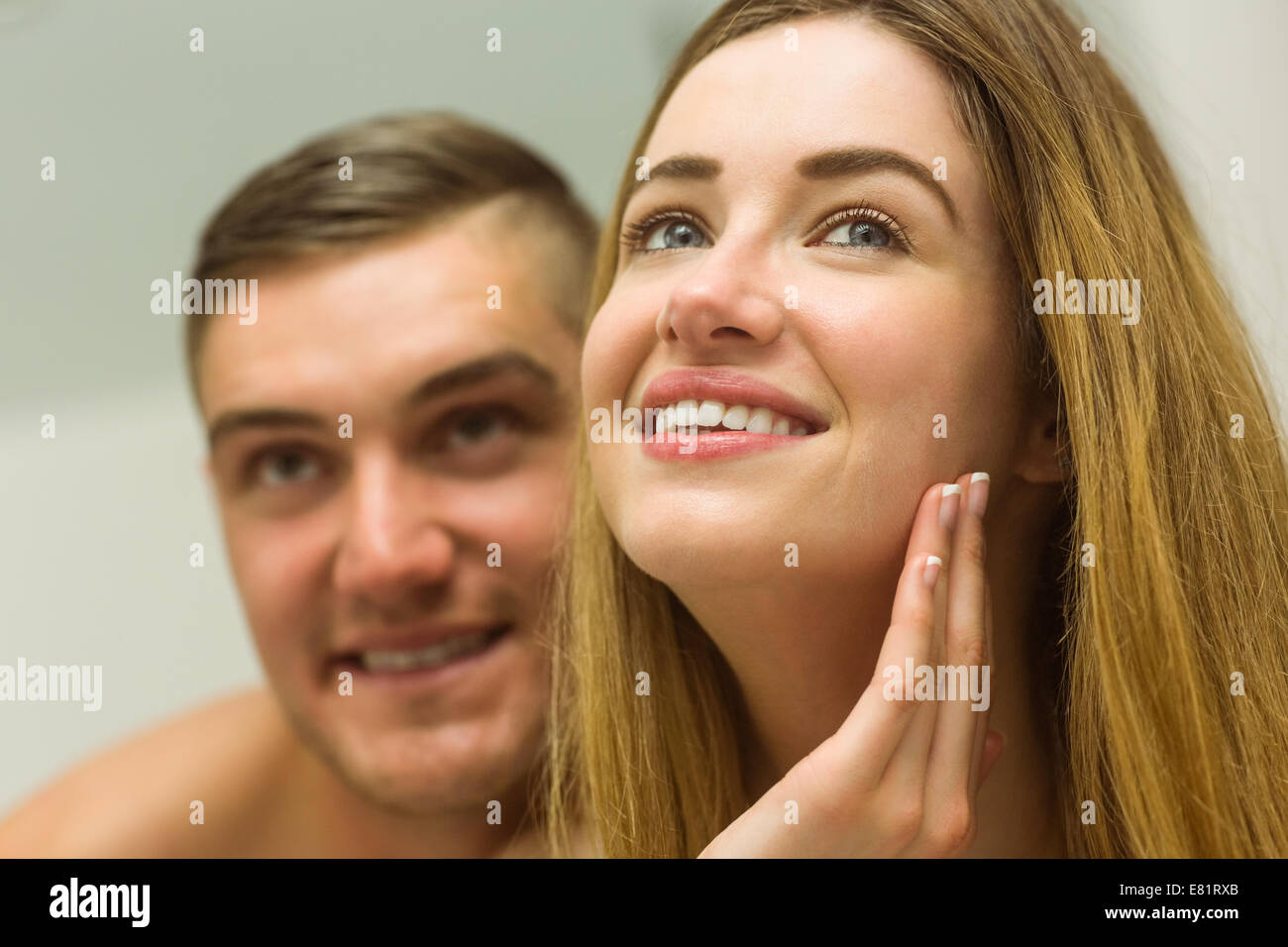 Cute couple smiling brightly together Stock Photo - Alamy