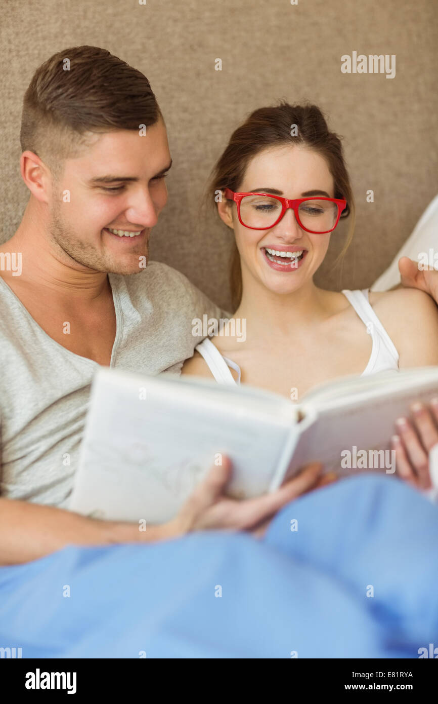 Couple reading book bed hi-res stock photography and images - Alamy