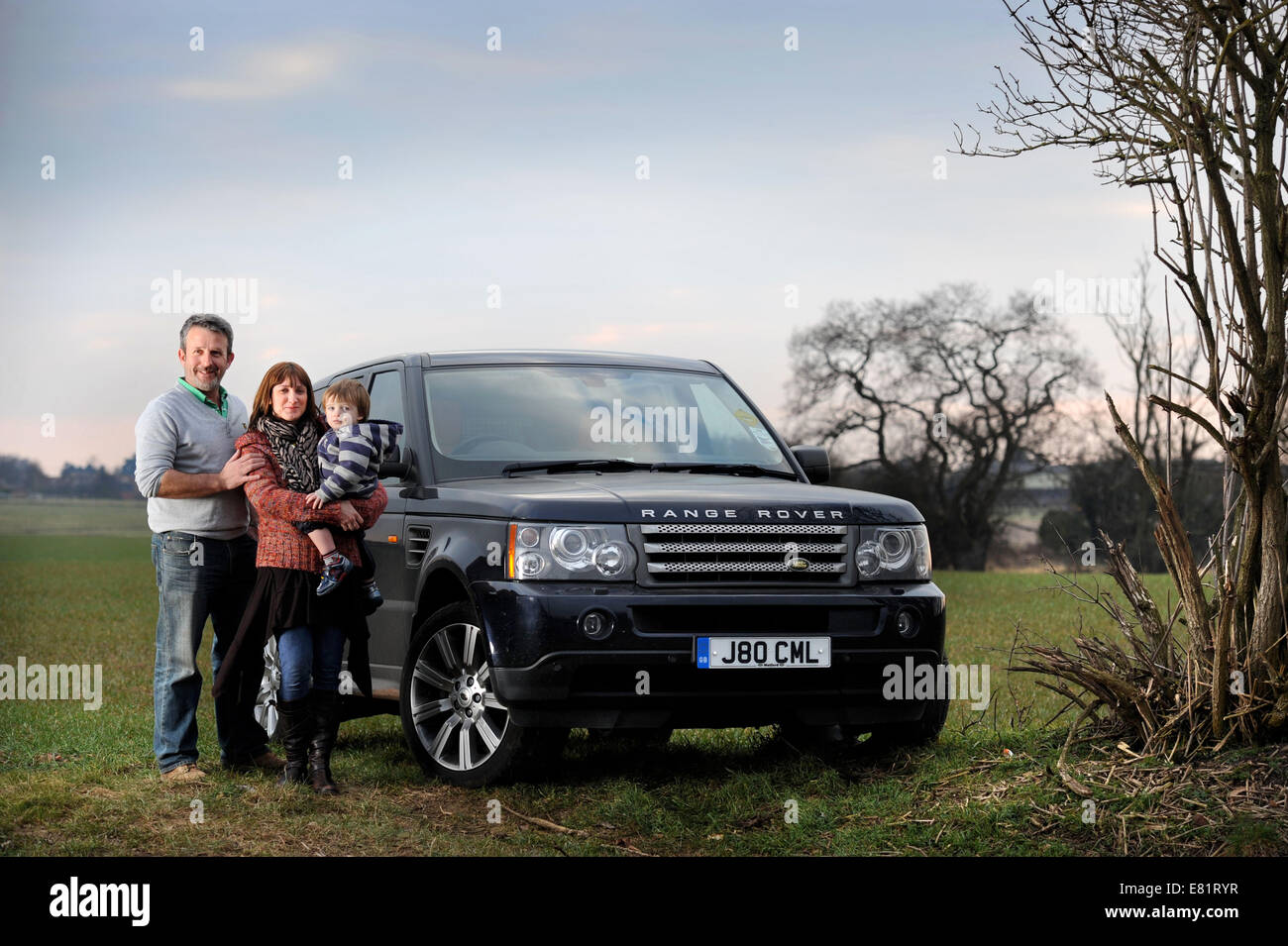 Family with a four wheel drive car UK Stock Photo - Alamy