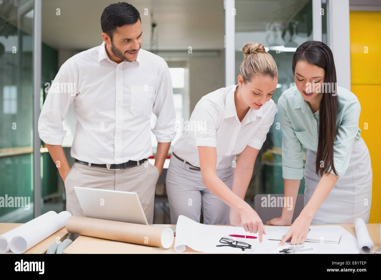 Architecture team working together at desk Stock Photo - Alamy