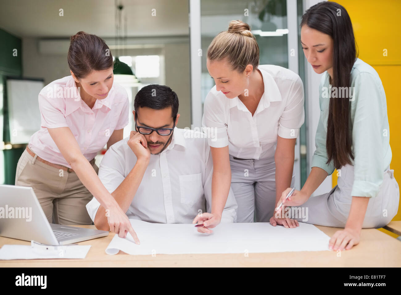 Architecture team working together at desk Stock Photo - Alamy