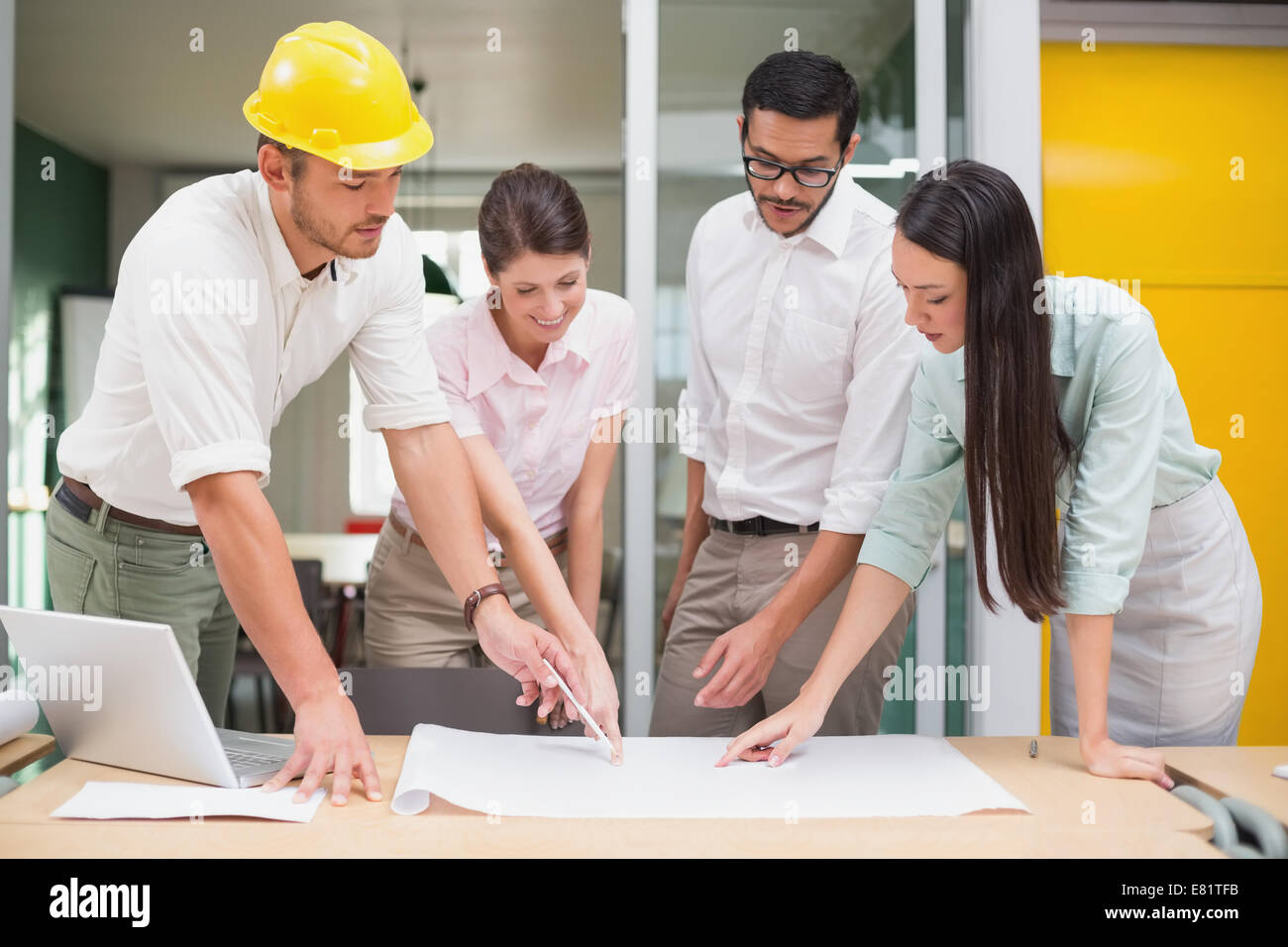 Architecture team working together at desk Stock Photo - Alamy
