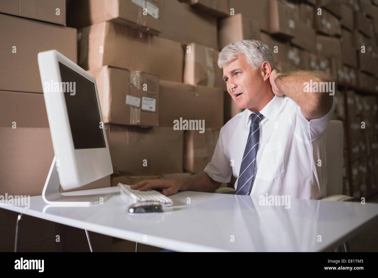 Warehouse manager using computer Stock Photo - Alamy