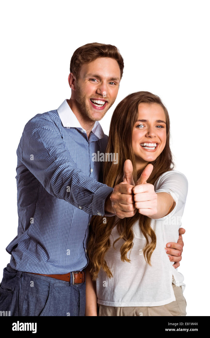 Happy couple gesturing thumbs up Stock Photo - Alamy