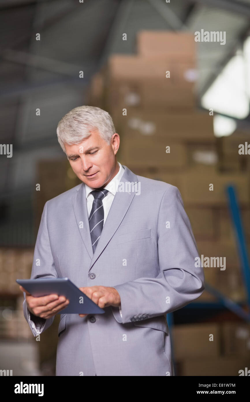 Male manager using digital tablet Stock Photo - Alamy