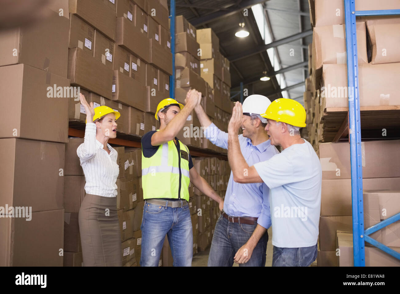 High fiving team in hi-res stock photography and images - Alamy