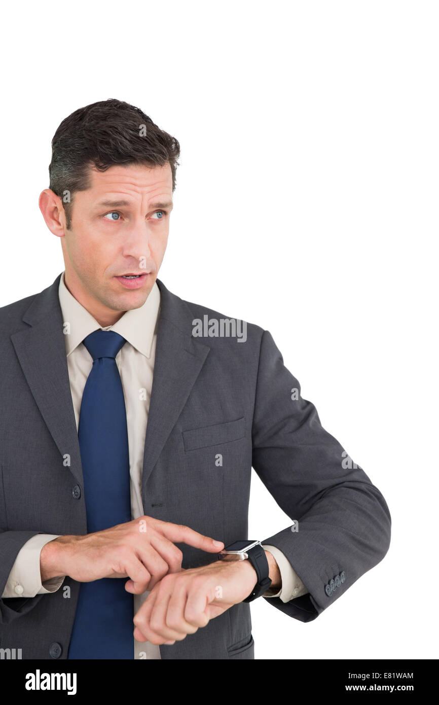 Businessman using his smart watch Stock Photo - Alamy
