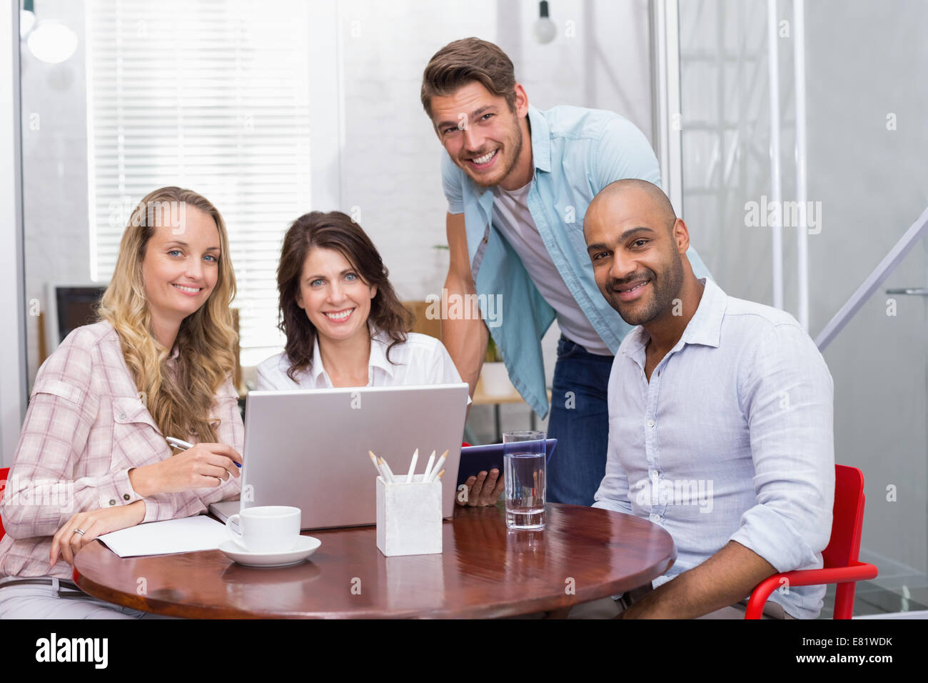Business team working together with laptop Stock Photo - Alamy