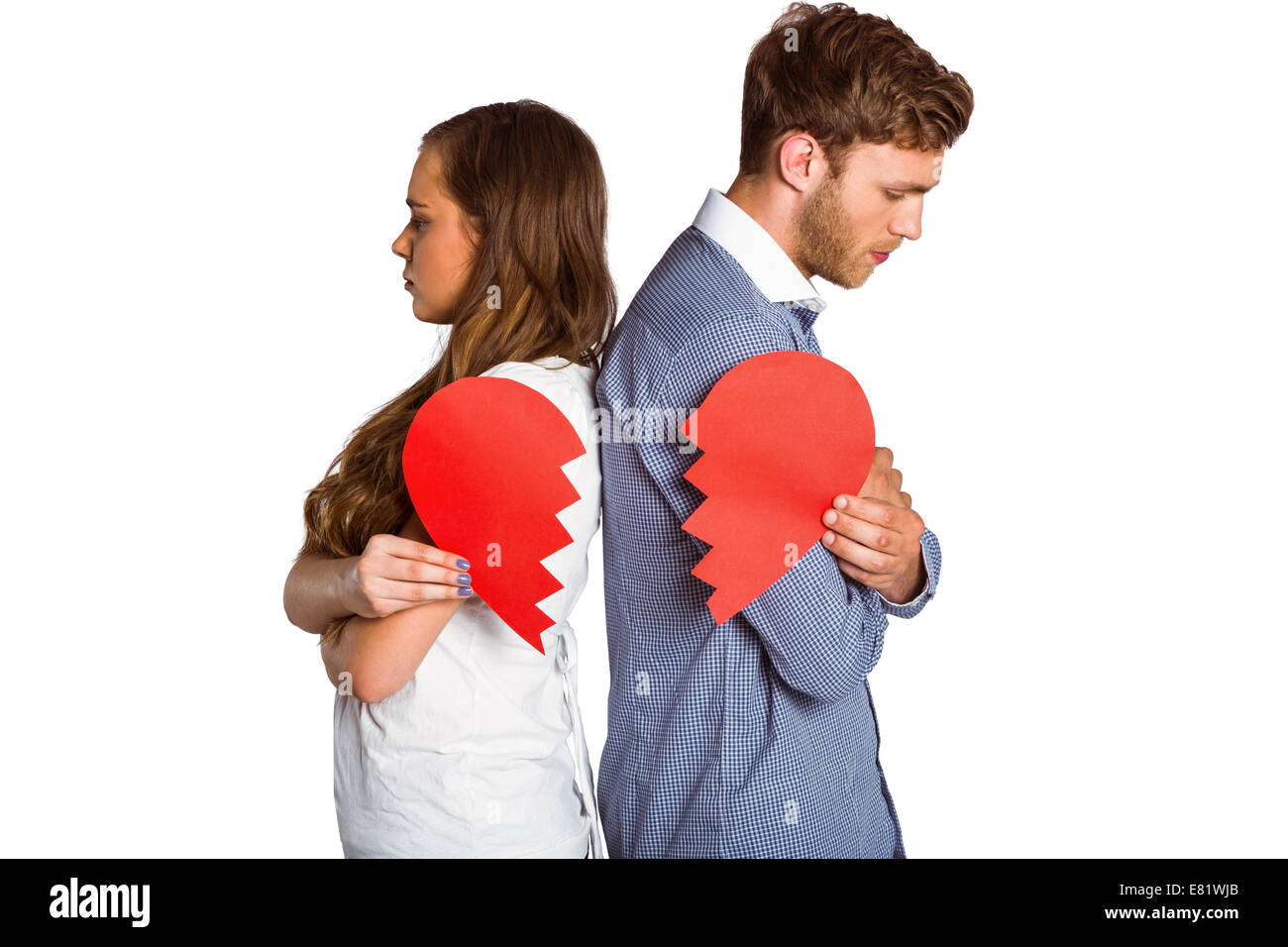 Young couple holding broken heart Stock Photo - Alamy